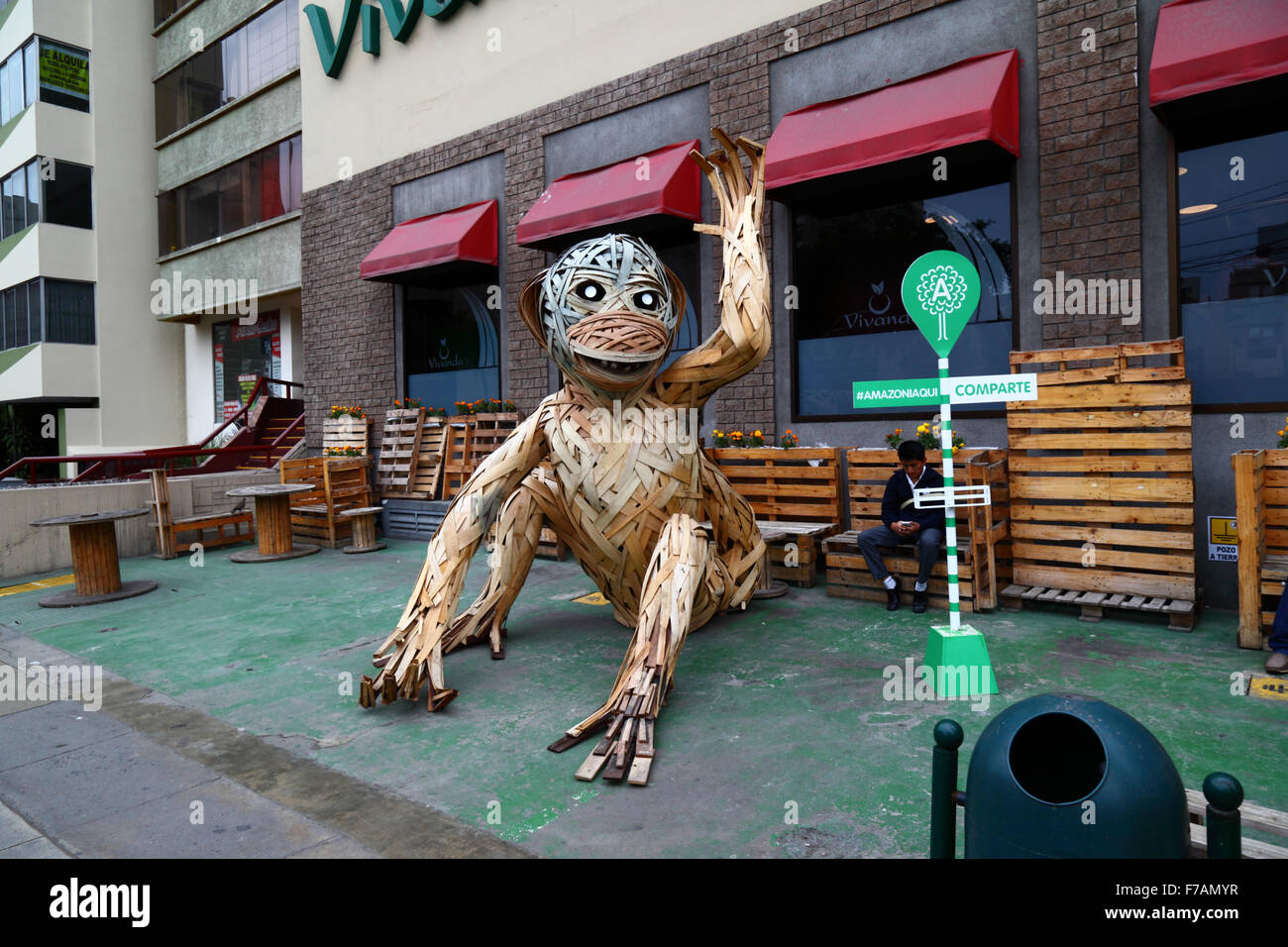 Wooden monkey outside Vivanda supermarket, part of campaign by NGO ...