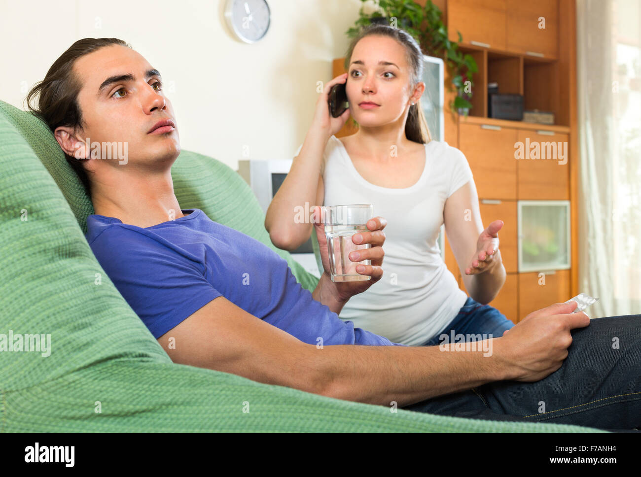 Girl calling for medical assistance for her sick boyfriend Stock Photo ...