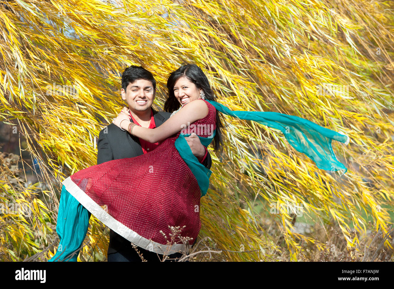Young Indian Man Carrying His Bride Stock Photo - Alamy
