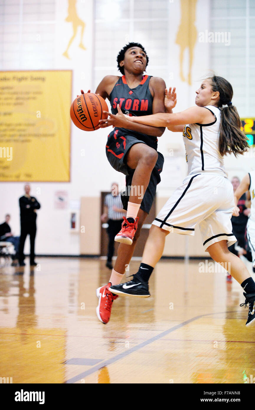 Forward executing an athletic move to complete a driving layup over an ...