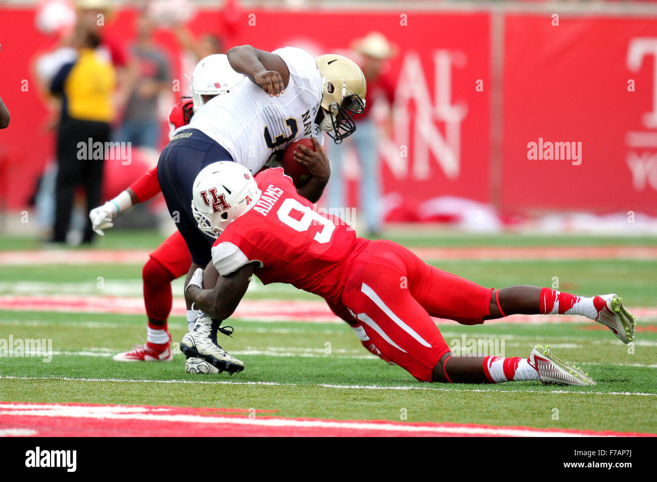 NOV 27 2015: Houston Cougars linebacker Matthew Adams (9) tackles Navy ...