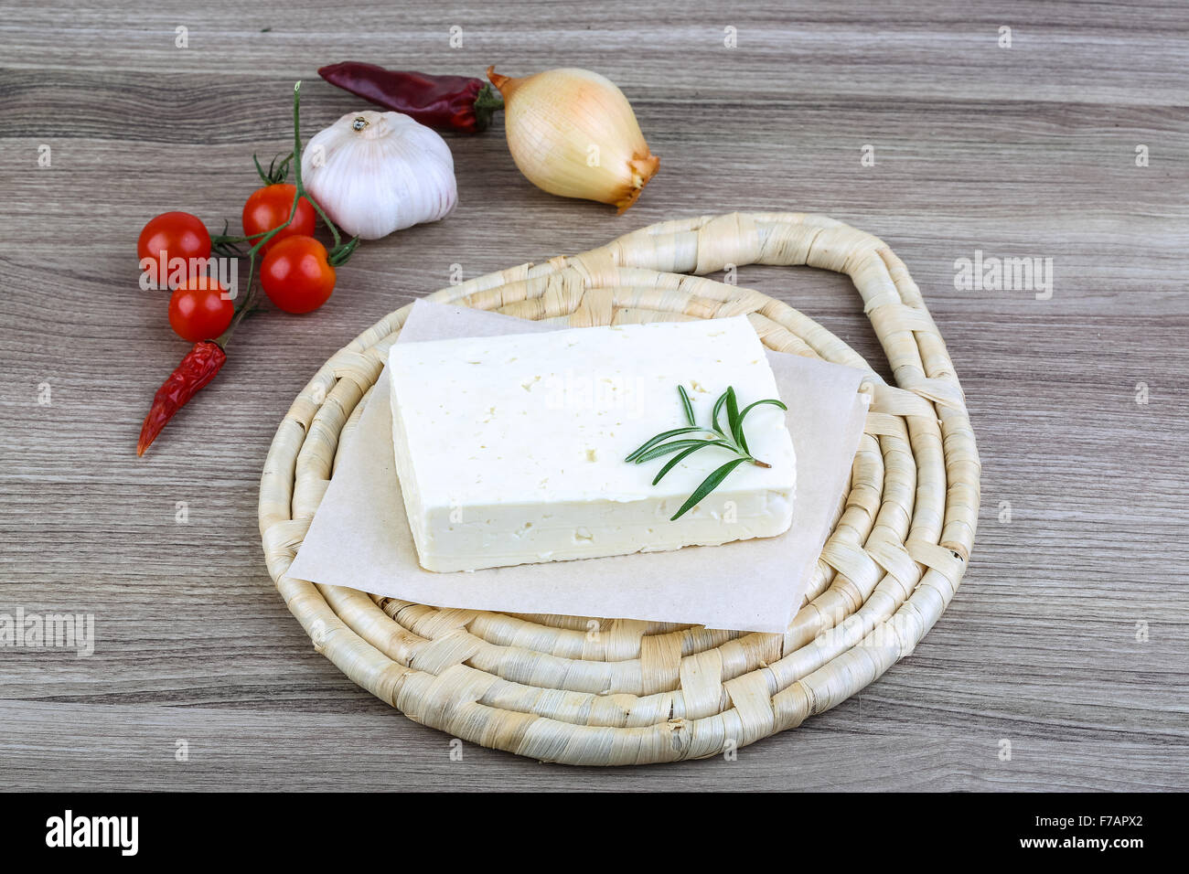 Traditional Caucasian homemade Cheese Brinza with rosemary on wood ...