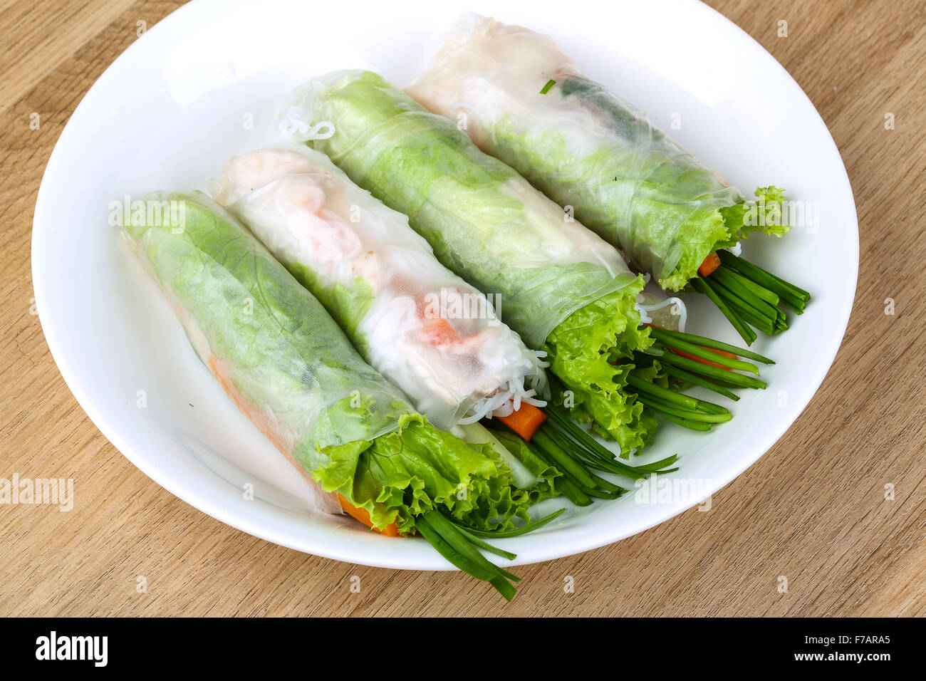 Asian traditional spring rolls on the wood background Stock Photo - Alamy
