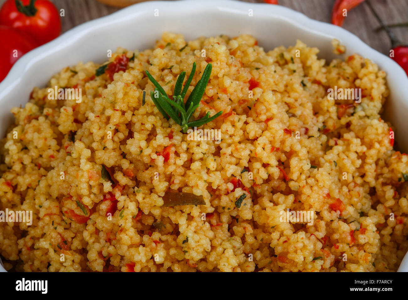 Arabic traditional cuisine - Couscous with tomato and green onion Stock ...
