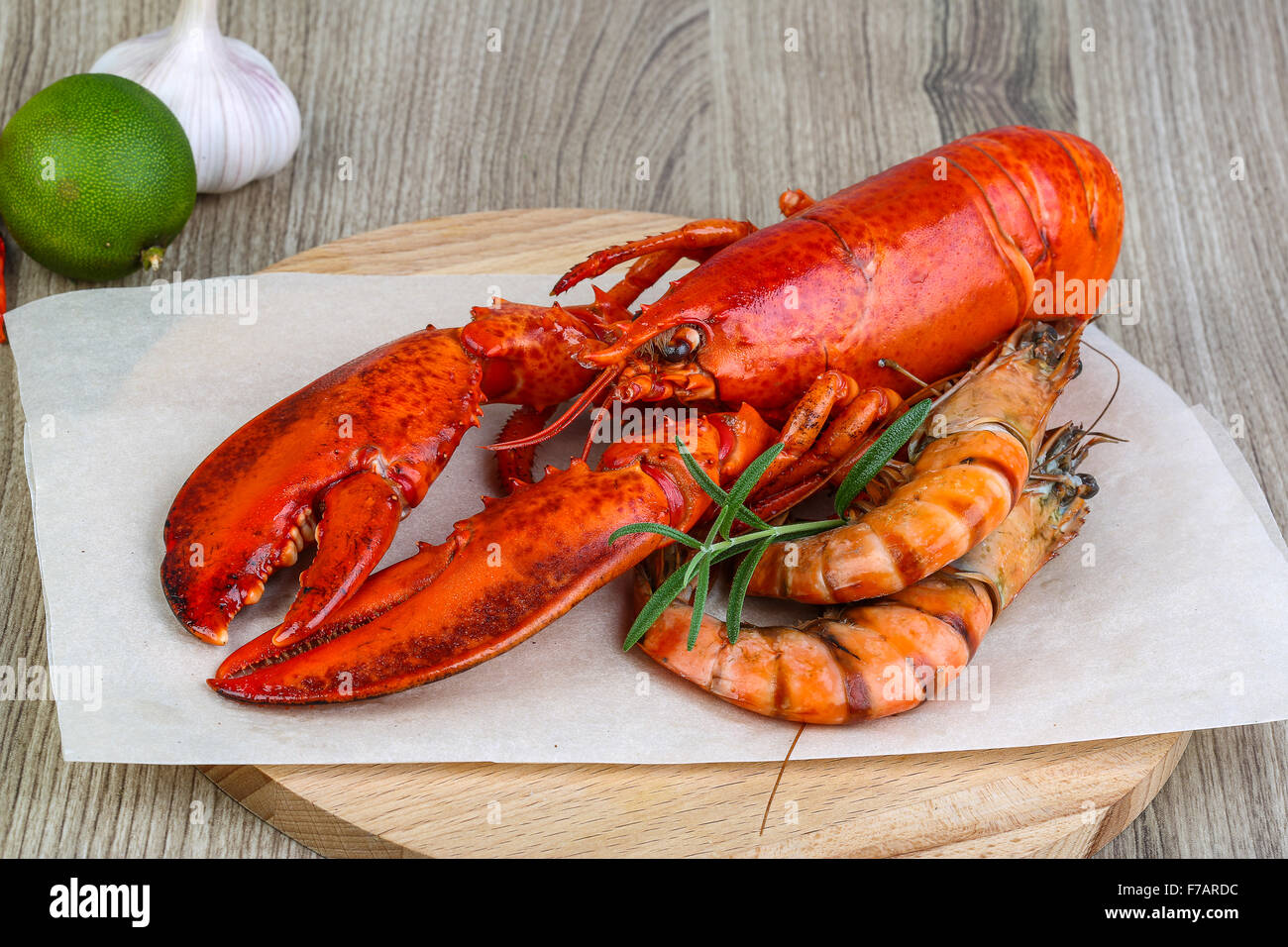 Big cooked lobster and tiger shrimps ready for eating Stock Photo - Alamy
