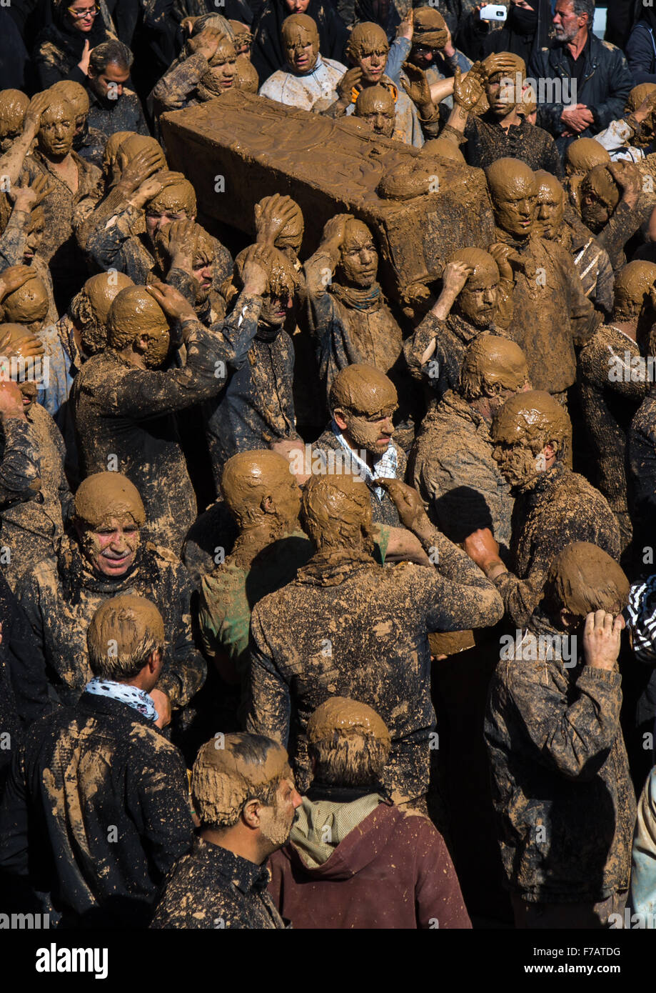 Iranian Shiite Muslim Men Covered In Mud Carrying A Coffin During ...