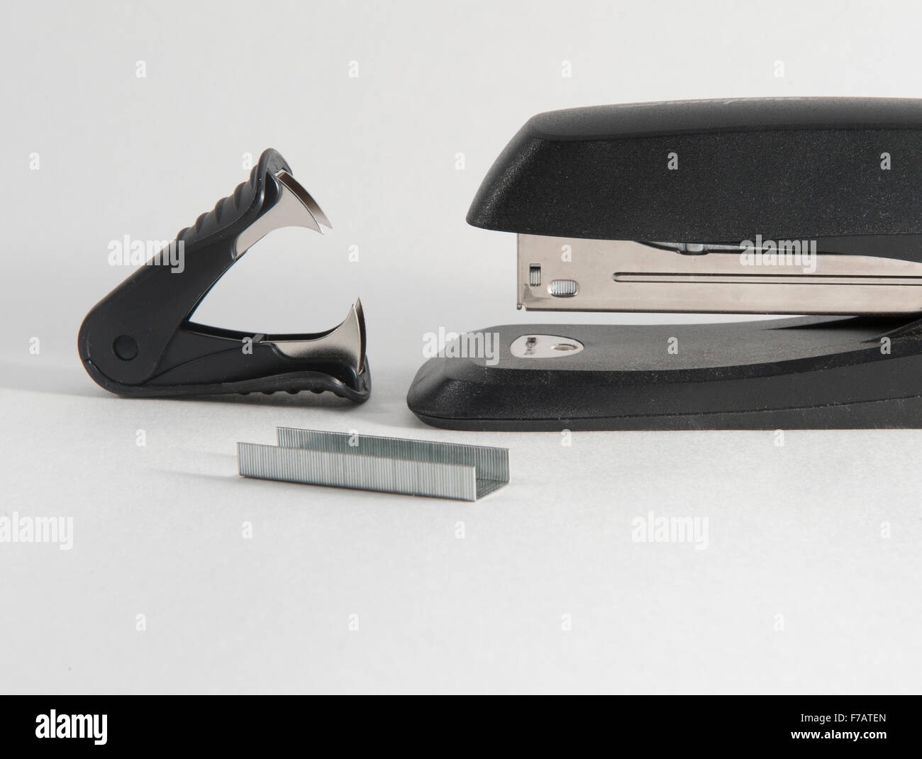 Stapler, staples and staple remover against a white background Stock ...