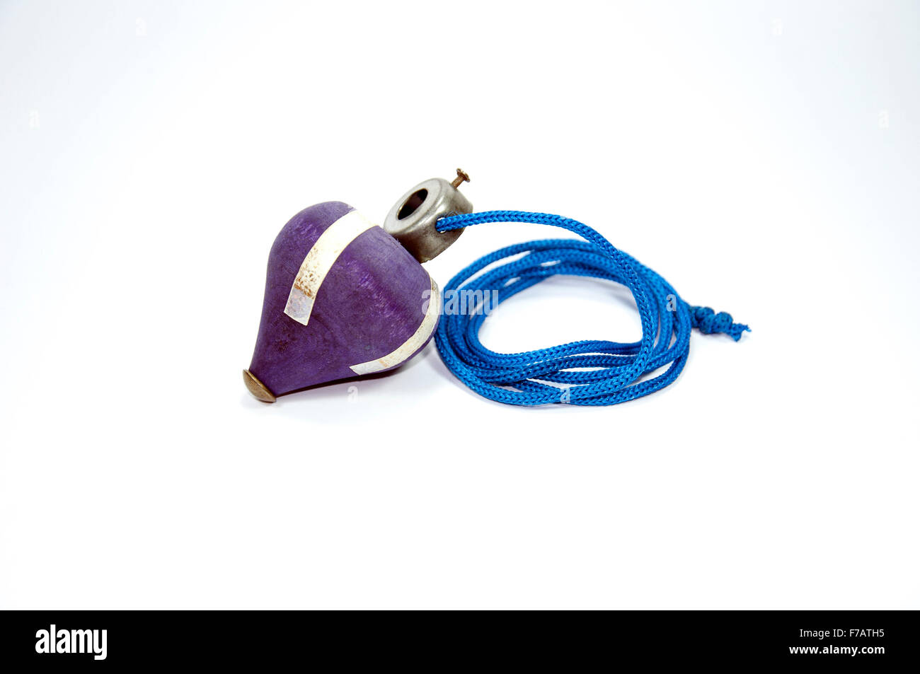 whipping toy - trompo on white background Stock Photo - Alamy