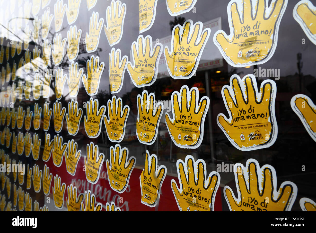 Hand symbols in window of McDonald's for the Da Una Mano / McDia Feliz ...