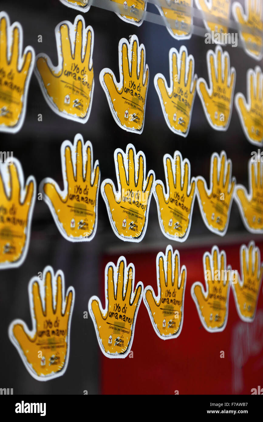 Hand symbols in window of McDonald's for the Da Una Mano / McDia Feliz ...
