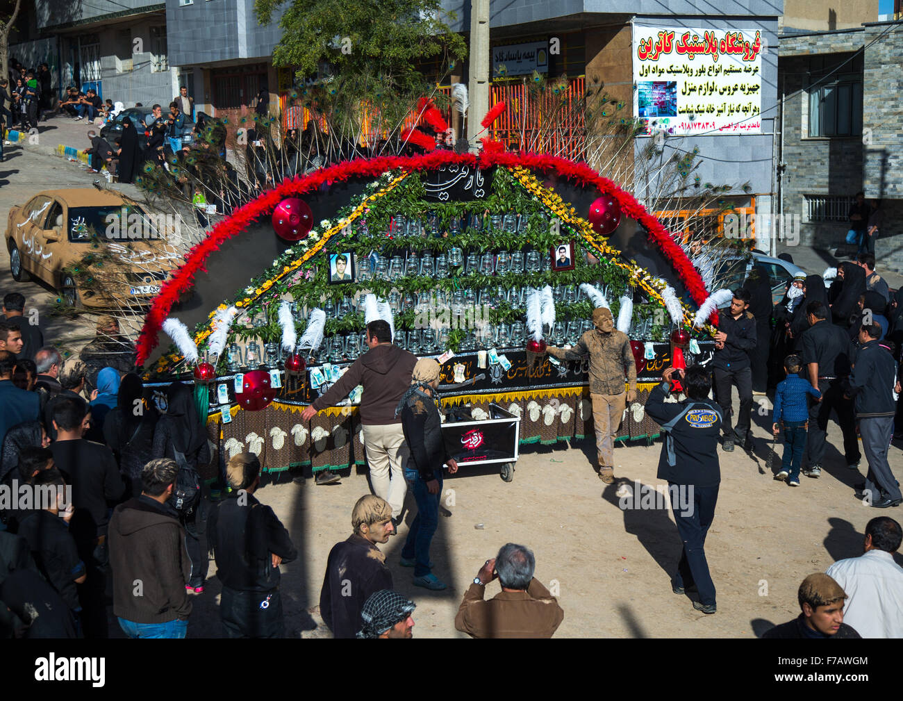 Iranian Shiite Muslim Men Carry An Alam With Forty Lamps On Ashura, The ...
