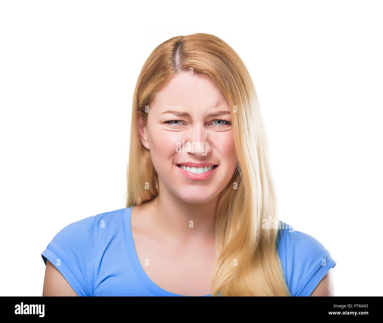 Blonde woman grimacing Stock Photo - Alamy