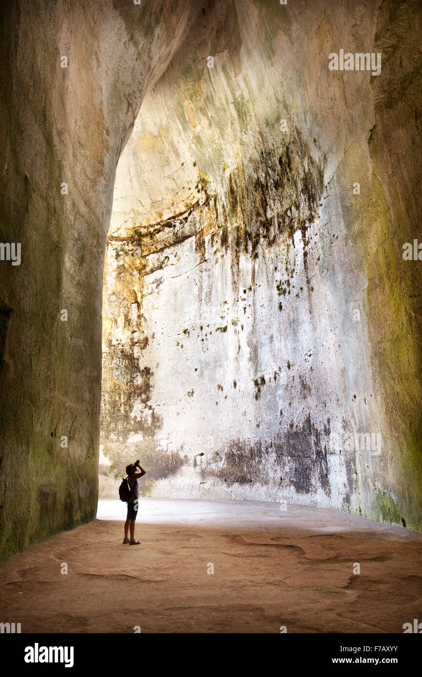 Tourist inside the cave Ear of Dionysius, Orecchio di Dionisio ...