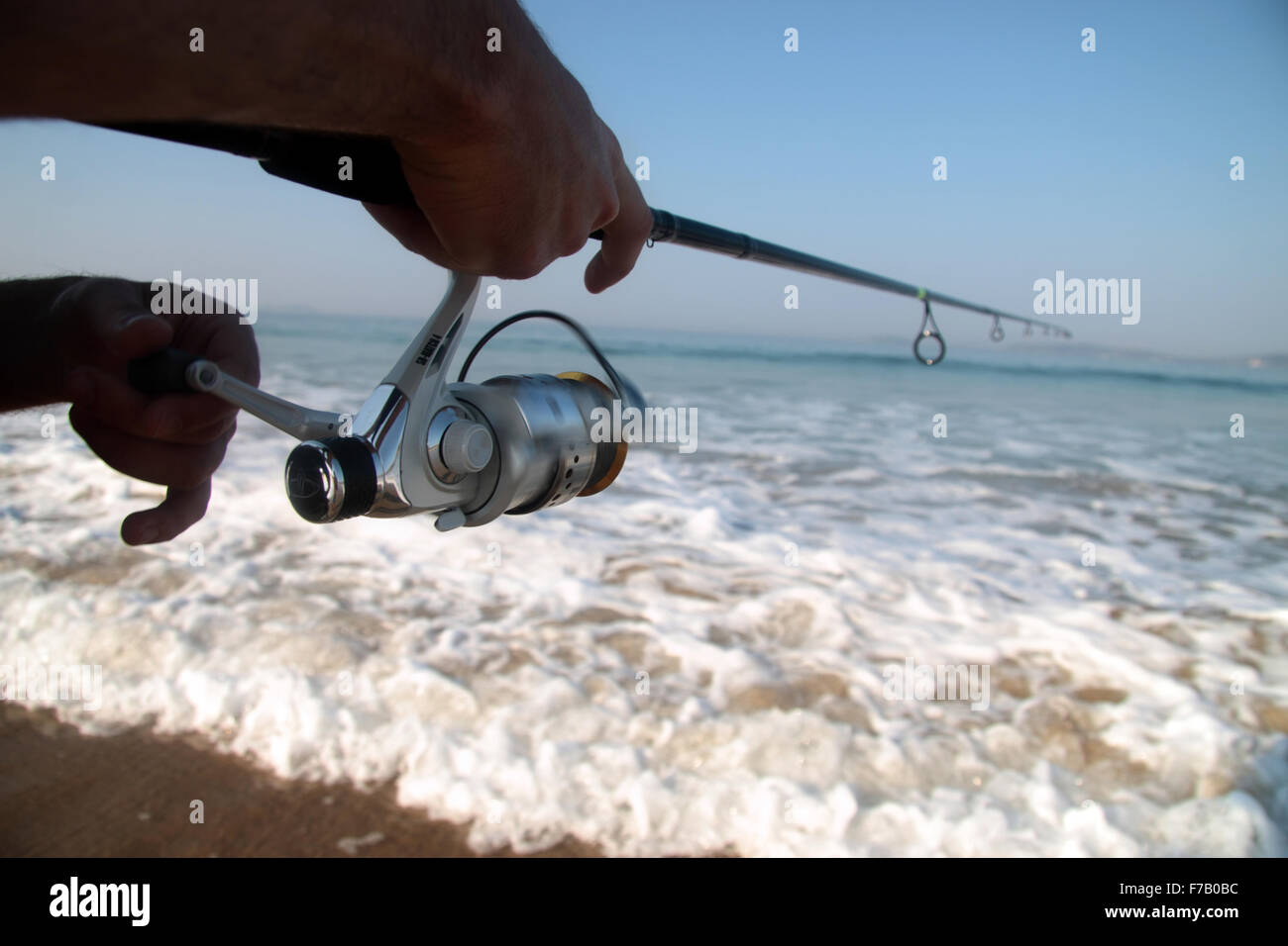 hands of a fisherman collecting line Stock Photo - Alamy