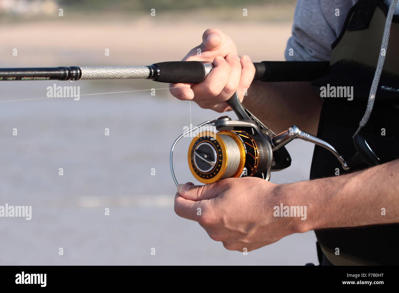hands of a fisherman collecting line Stock Photo - Alamy
