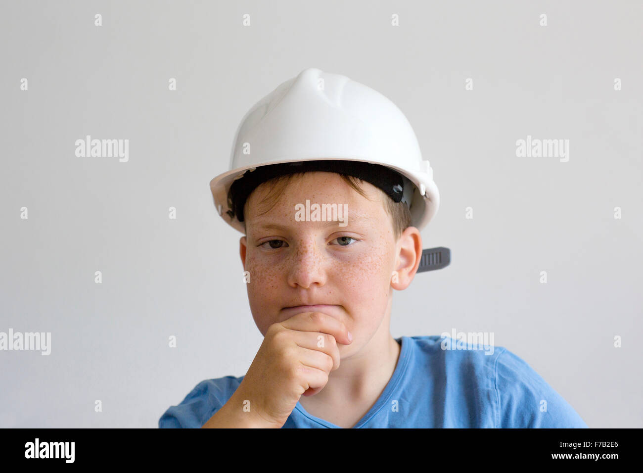 MODEL RELEASED. Boy wearing hard hat Stock Photo - Alamy
