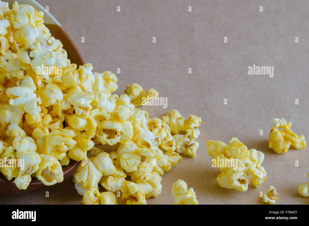 Caramel Popcorn Spill Out of Bowl Stock Photo - Alamy