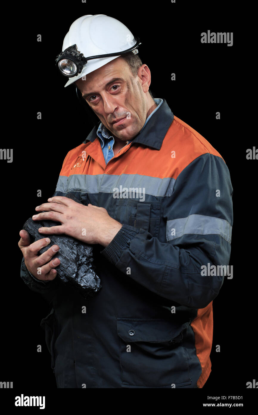 Coal miner showing lump of coal Stock Photo - Alamy