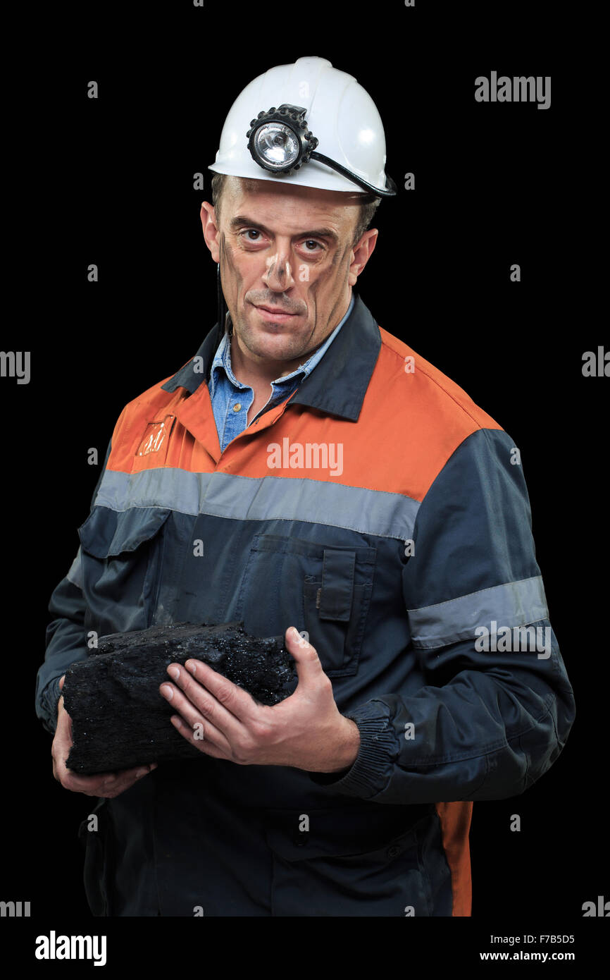 Coal miner showing lump of coal Stock Photo - Alamy