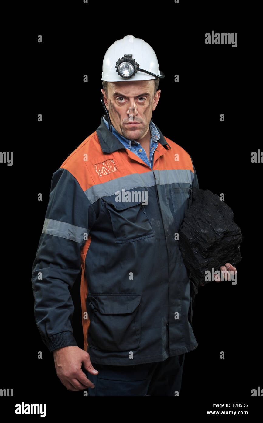 Coal miner showing lump of coal Stock Photo - Alamy
