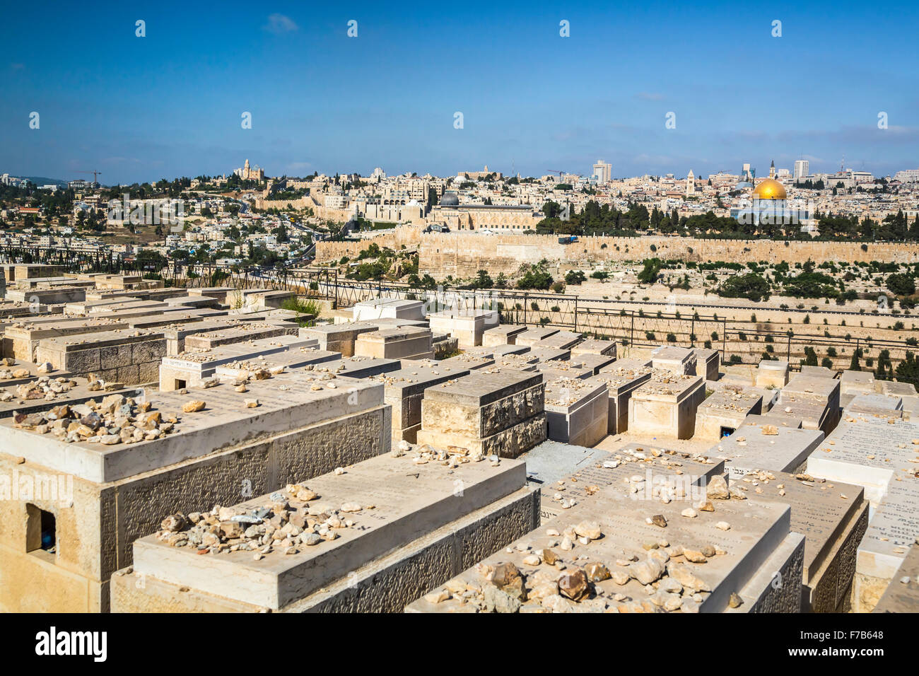 A view of the Jewish cemetery and the old walled city of Jerusalem ...