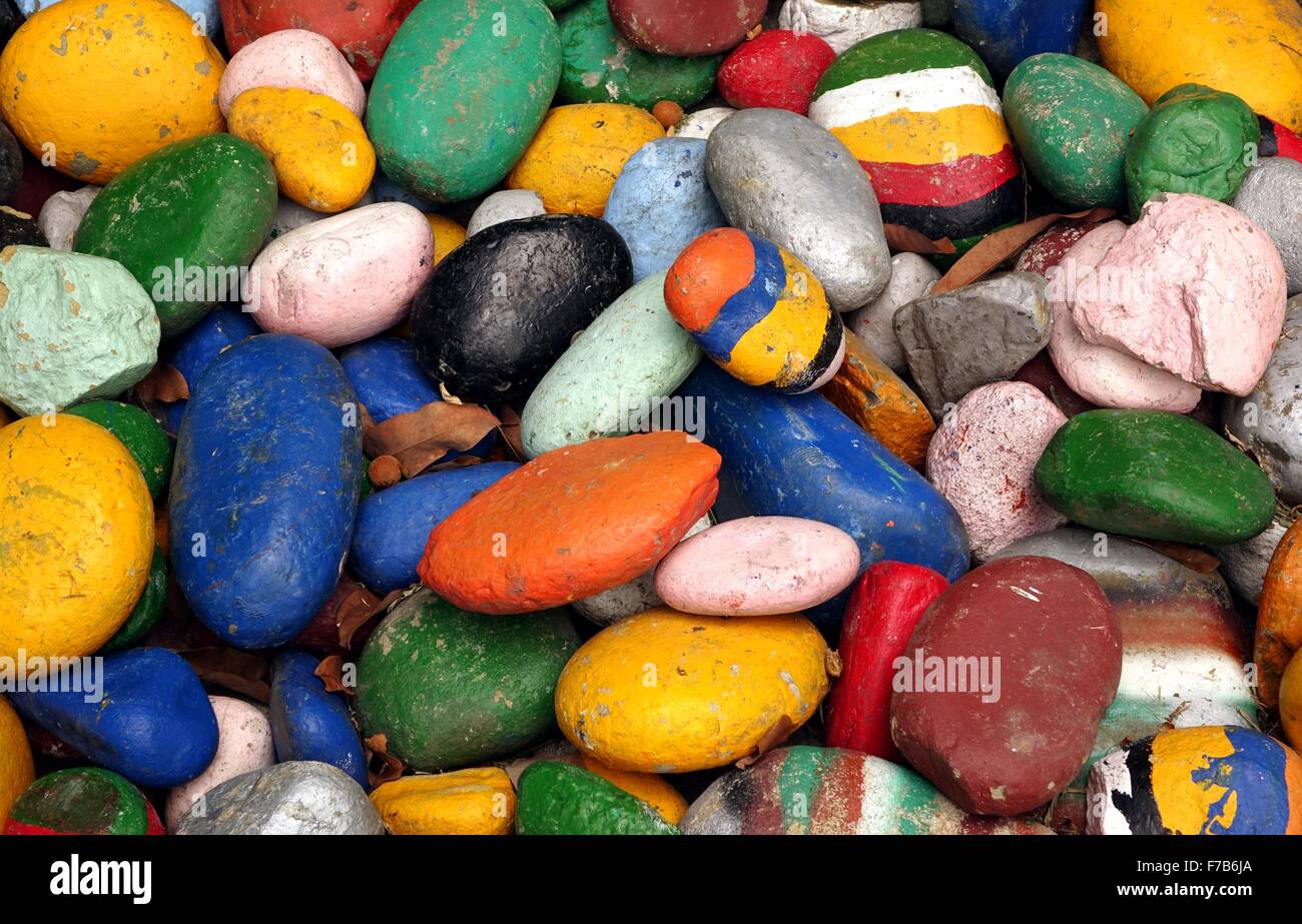 These large round pebbles painted in bright colors make for a nice ...