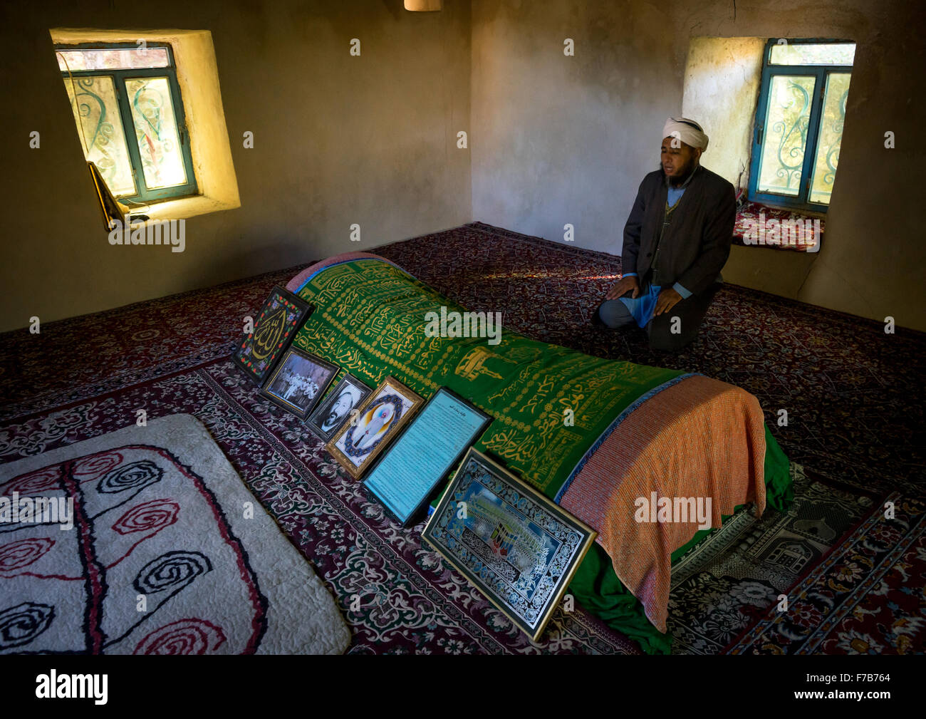 Iranian Shiite Iman Praying Inside A Shrine In Front Of A Tomb ...