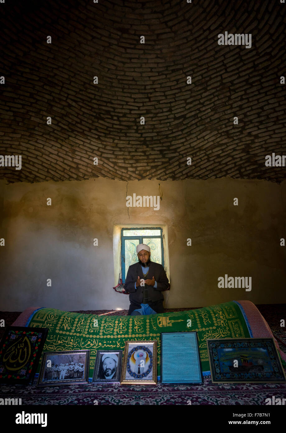 Iranian Shiite Iman Praying Inside A Shrine In Front Of A Tomb ...