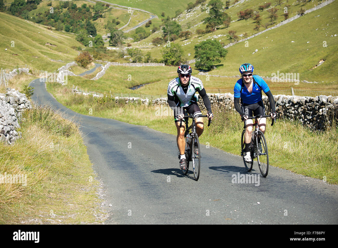 Cycling in the Yorkshire Dales National Park, UK. Two cyclists on the ...