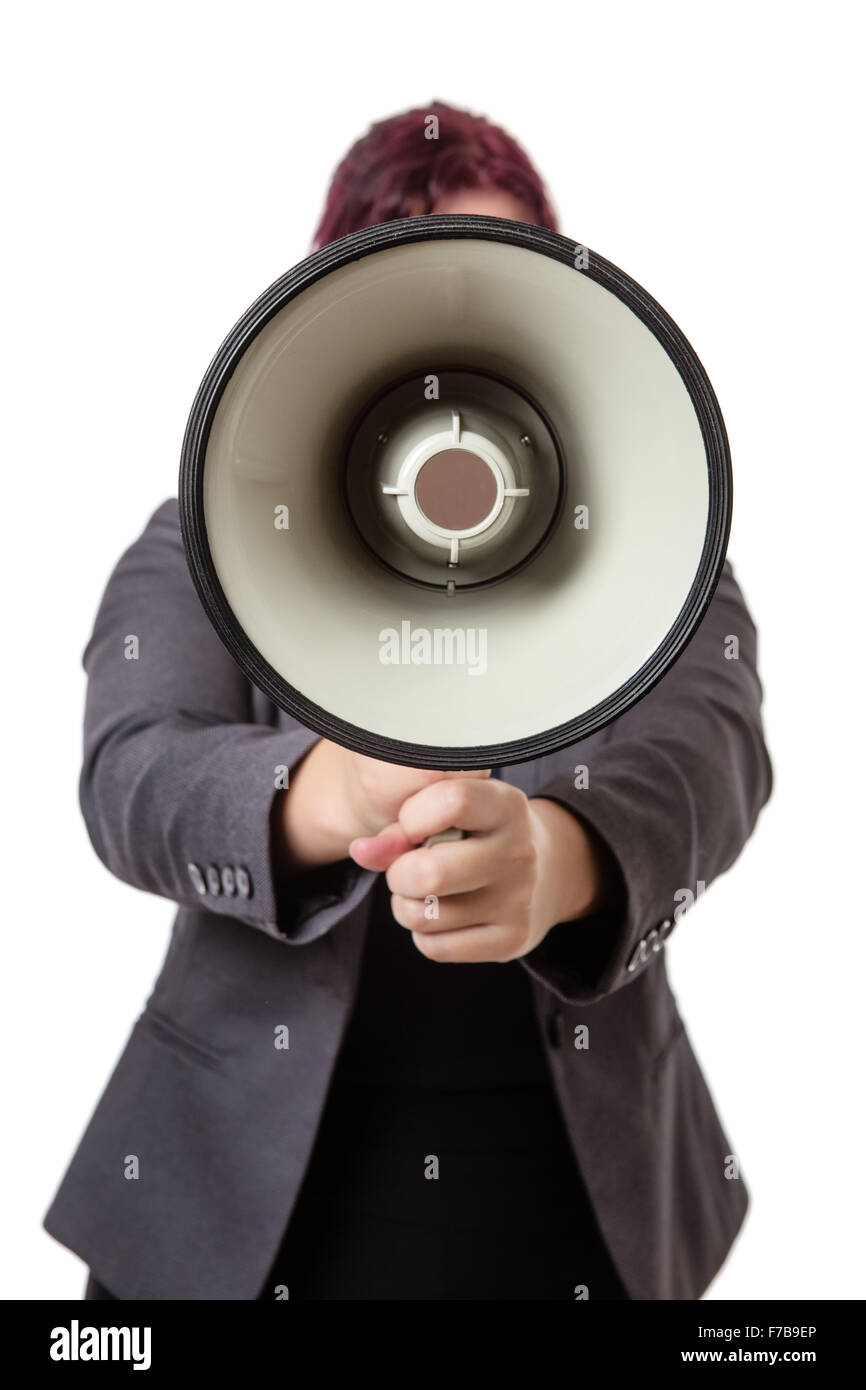 Business woman standing holding a megaphone/ bullhorn in front of her ...
