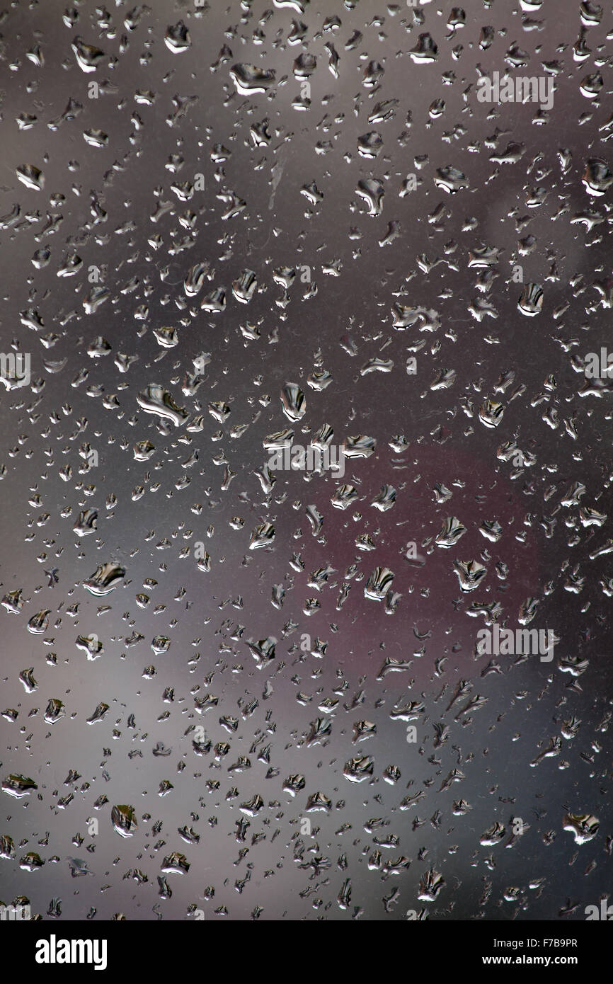 Raindrops on the surface of the dusty window Stock Photo - Alamy