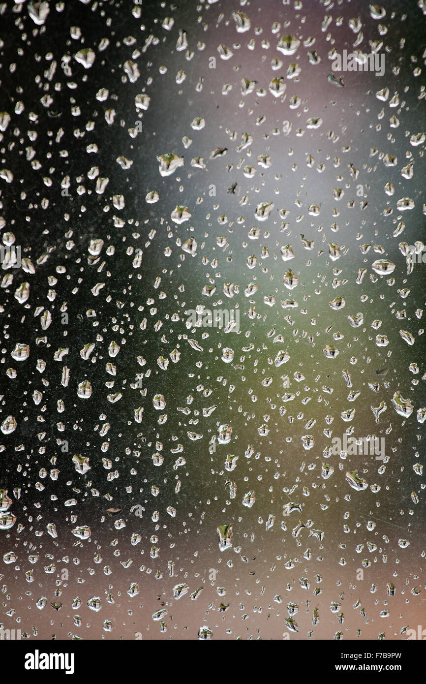 Raindrops on the surface of the dusty window Stock Photo - Alamy