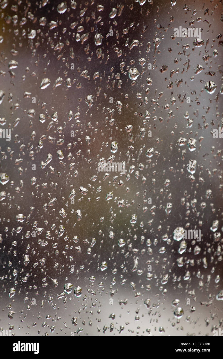 Raindrops on the surface of the dusty window Stock Photo - Alamy