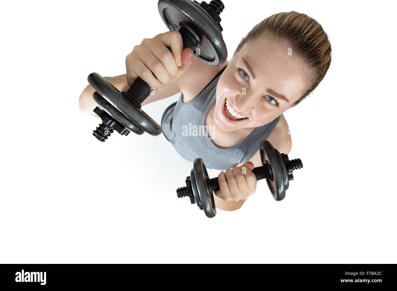 Shot from above of fitness woman using dumbbells Stock Photo - Alamy