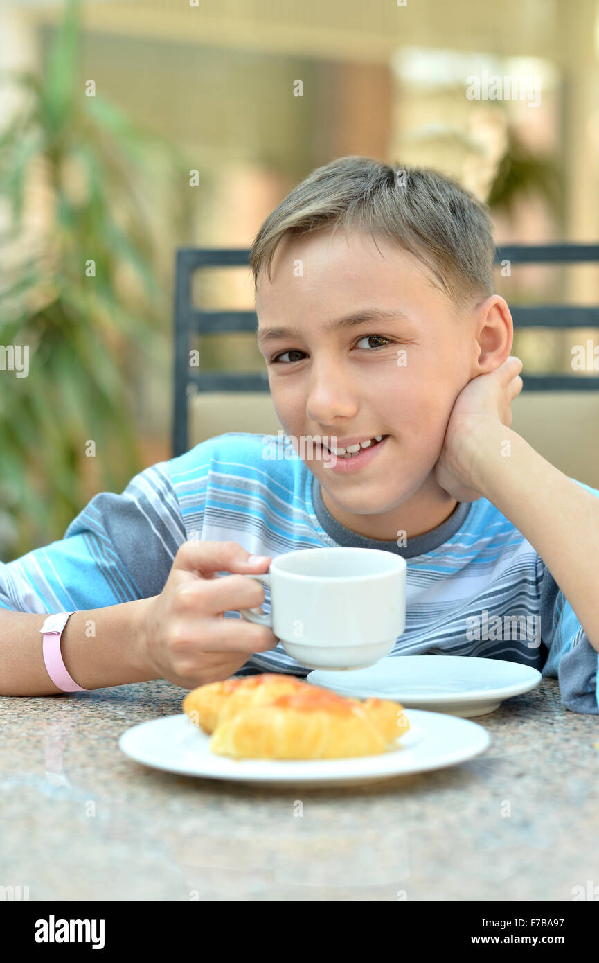 Happy boy at breakfast Stock Photo - Alamy