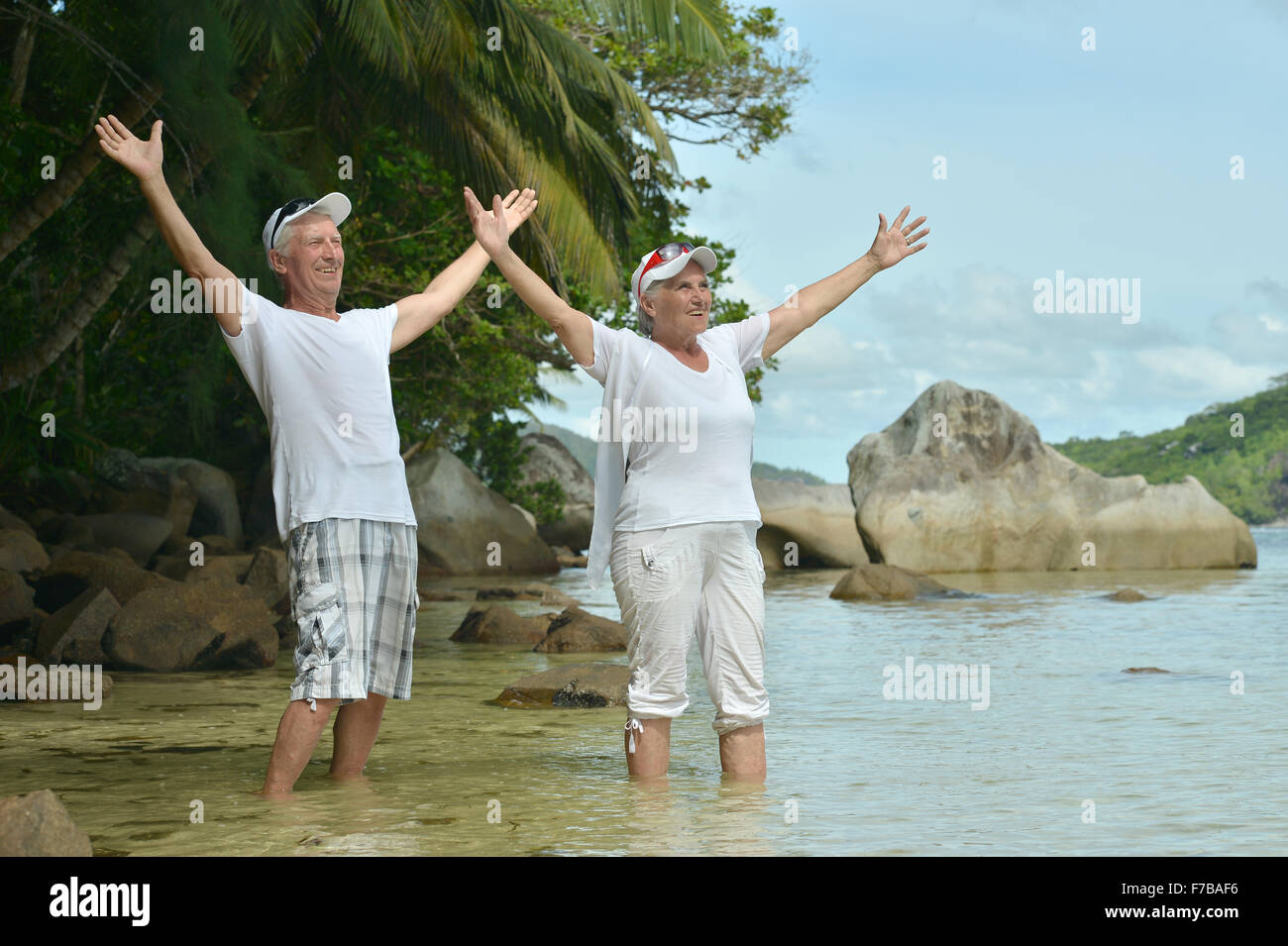elderly couple rest at tropical resort Stock Photo - Alamy