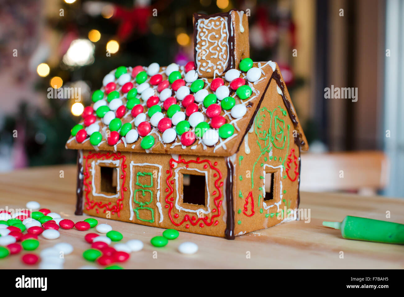 Gingerbread fairy house background of bright Christmas tree with ...