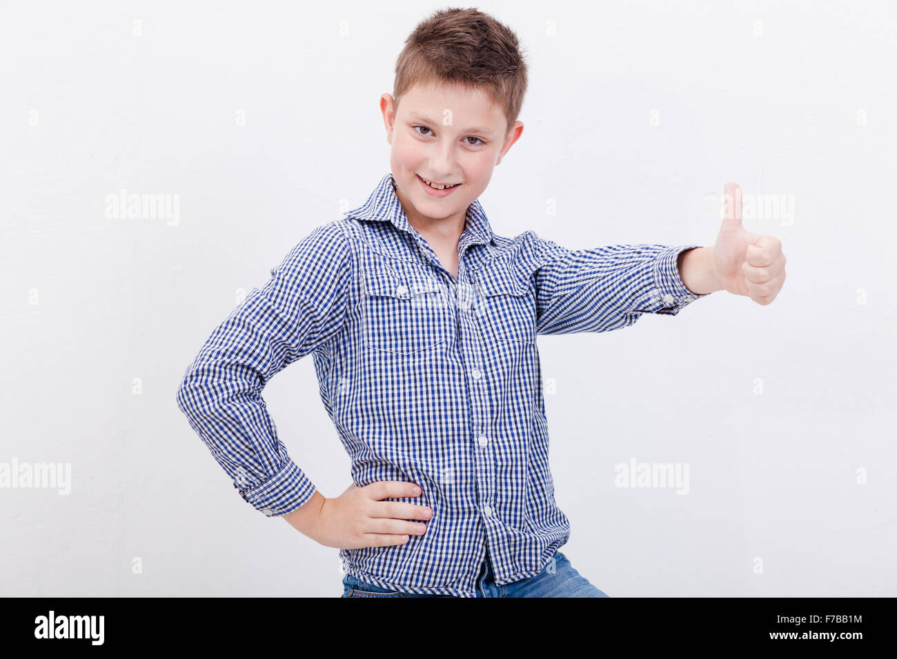 Portrait of happy boy showing thumb up gesture Stock Photo - Alamy