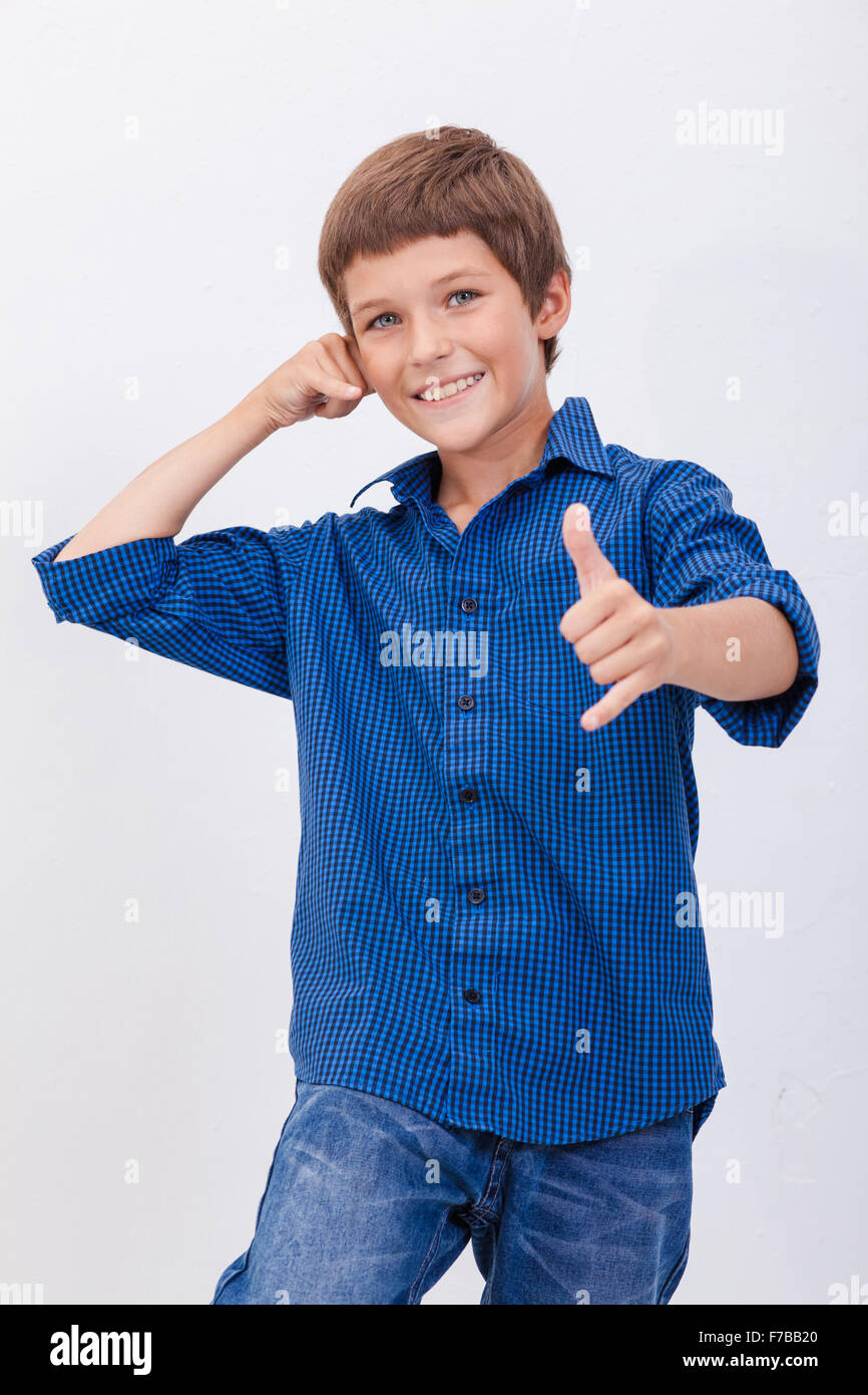 Happy young boy with calling gesture over white background Stock Photo ...