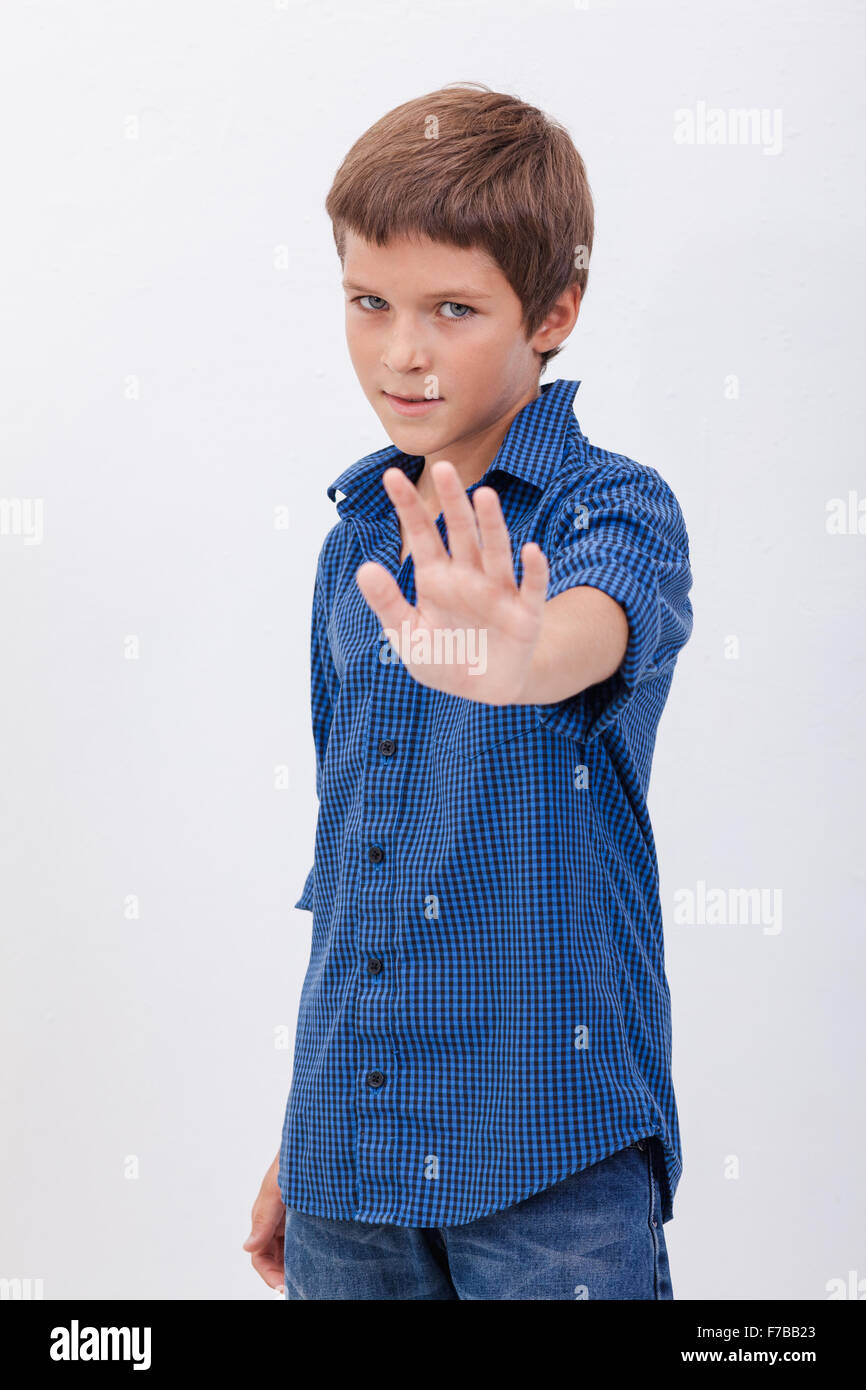 Handsome boy doing stop sign Stock Photo - Alamy