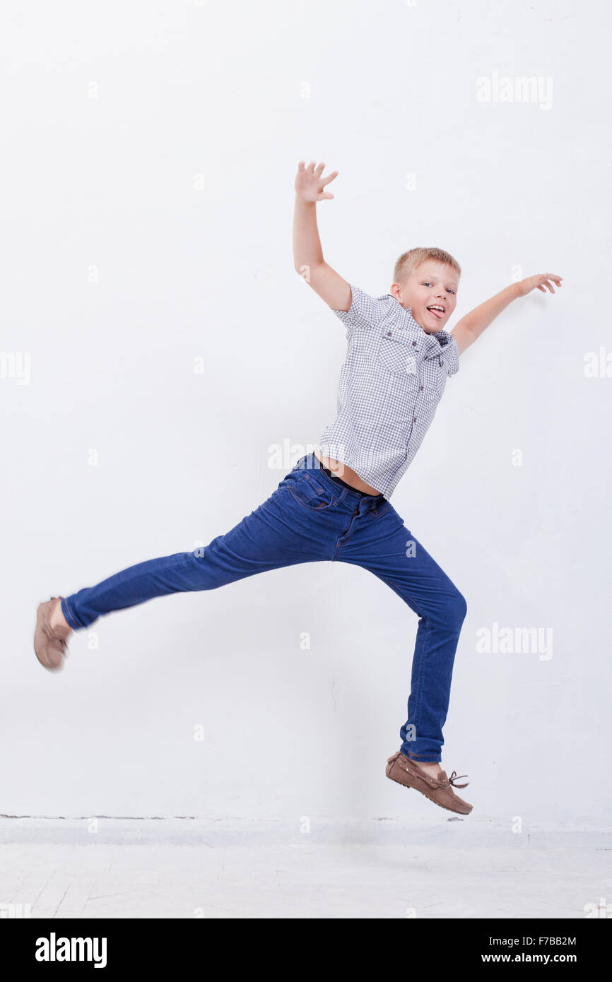 happy young boy jumping on white background Stock Photo - Alamy