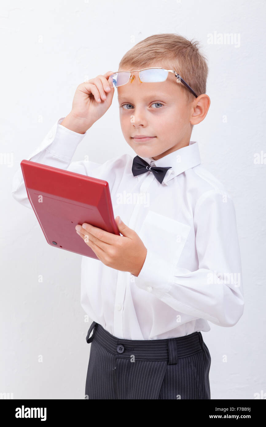 Portrait of teen boy with calculator on white background Stock Photo ...