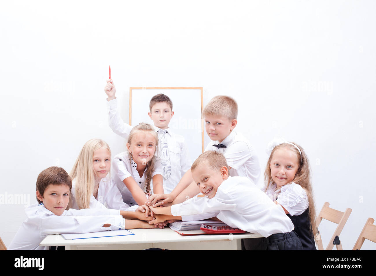 group of teen pupils. They holding their hands together Stock Photo - Alamy