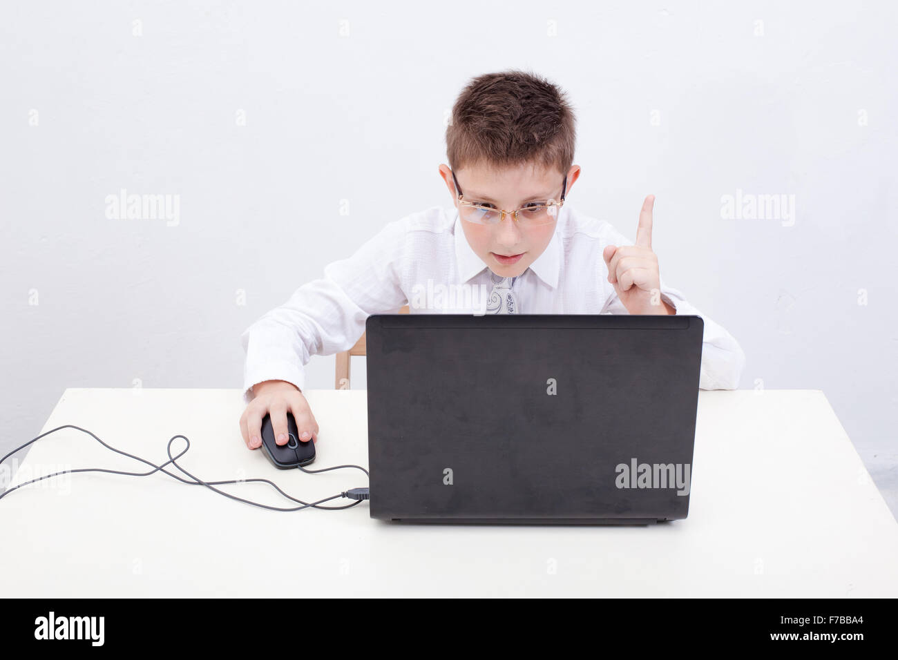 Boy using his laptop computer Stock Photo - Alamy
