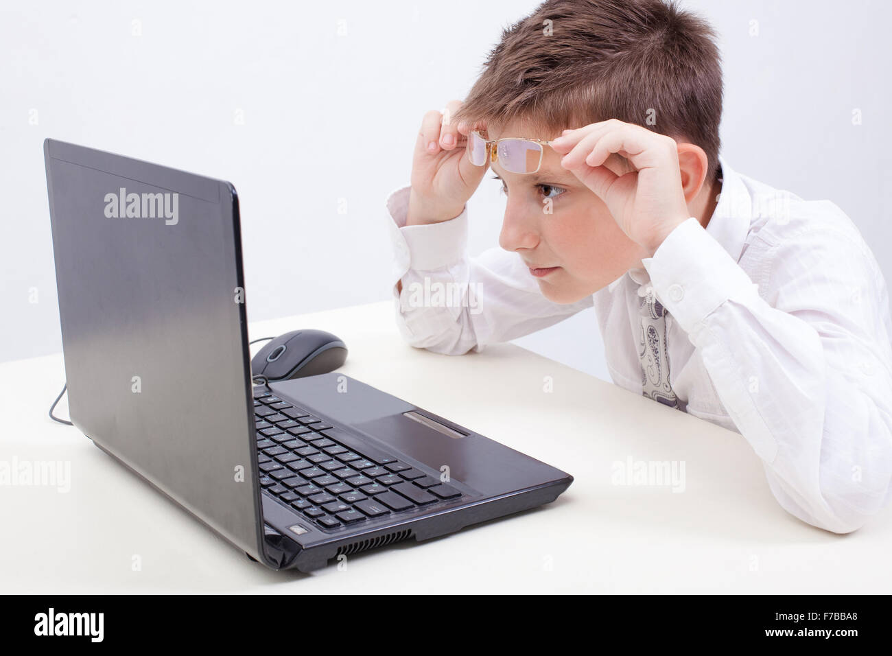 Boy using his laptop computer Stock Photo - Alamy
