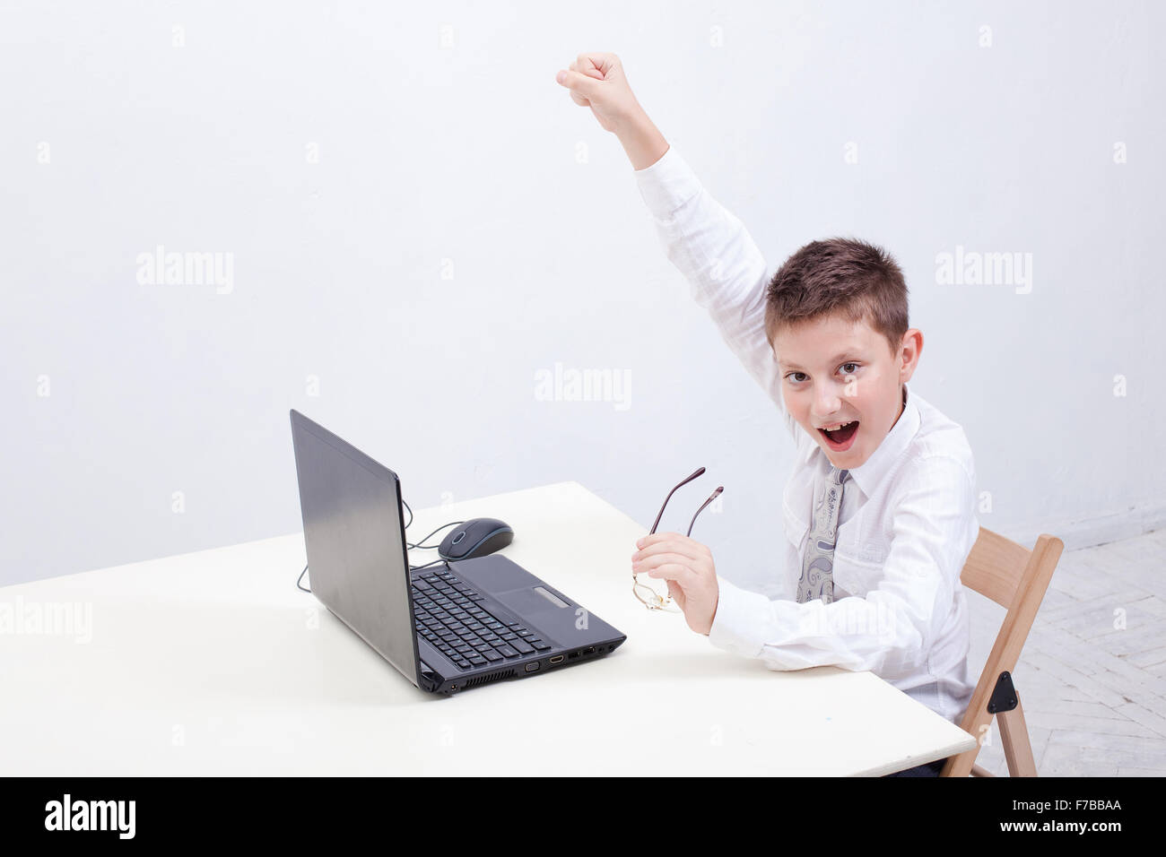 Boy using his laptop computer Stock Photo - Alamy