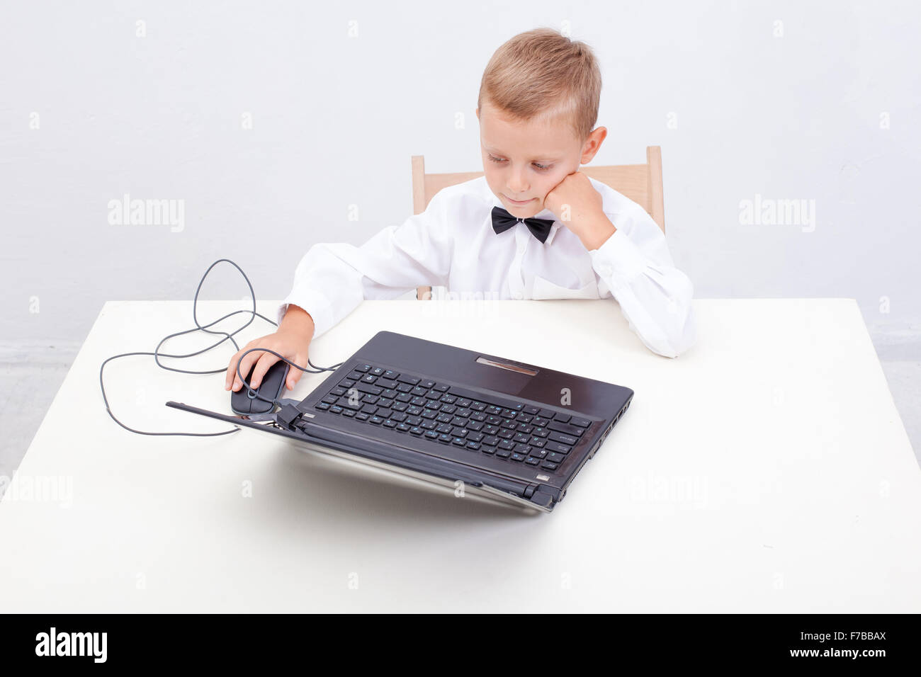 Boy using his laptop computer Stock Photo - Alamy