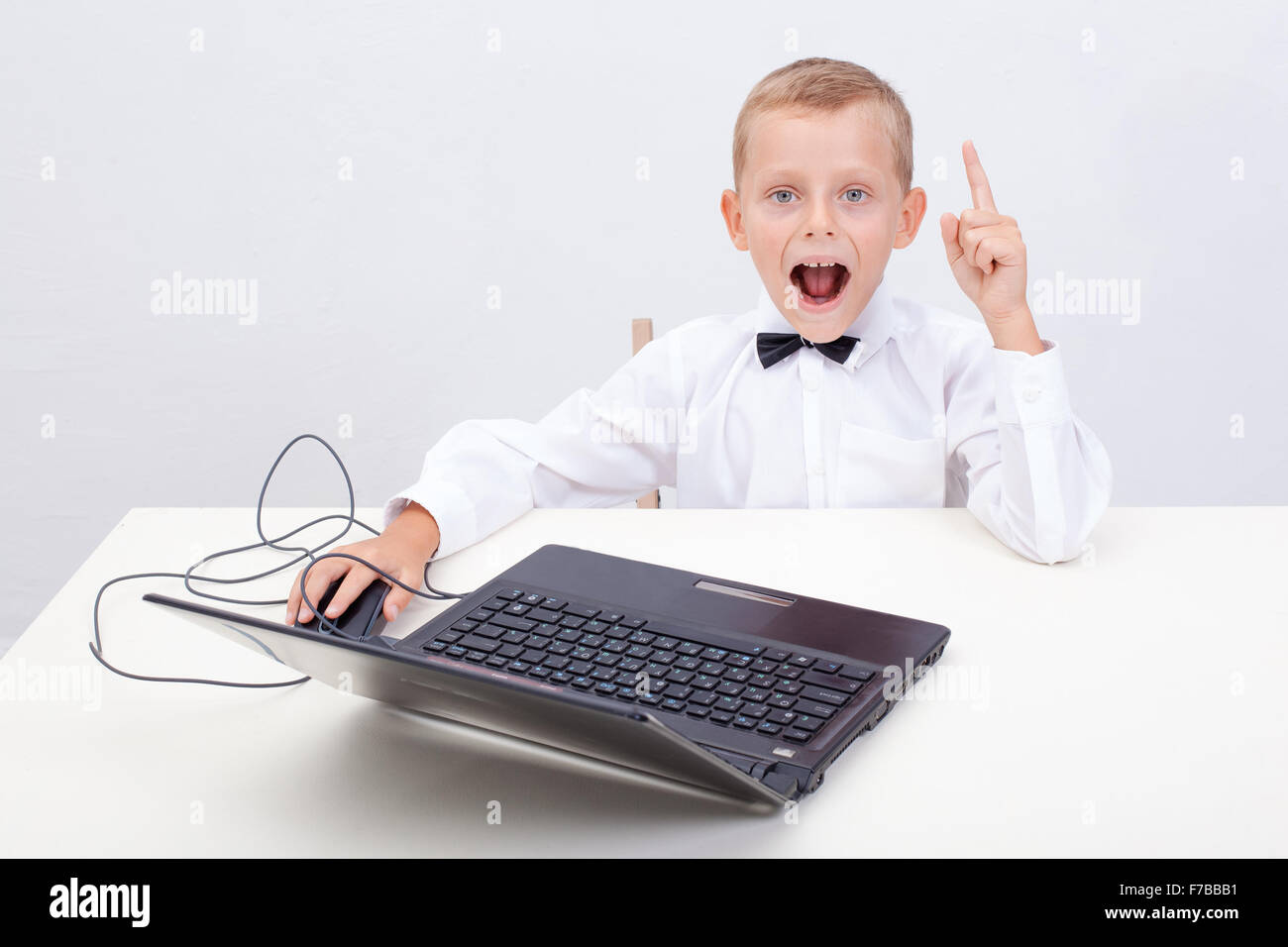 Boy using his laptop computer Stock Photo - Alamy
