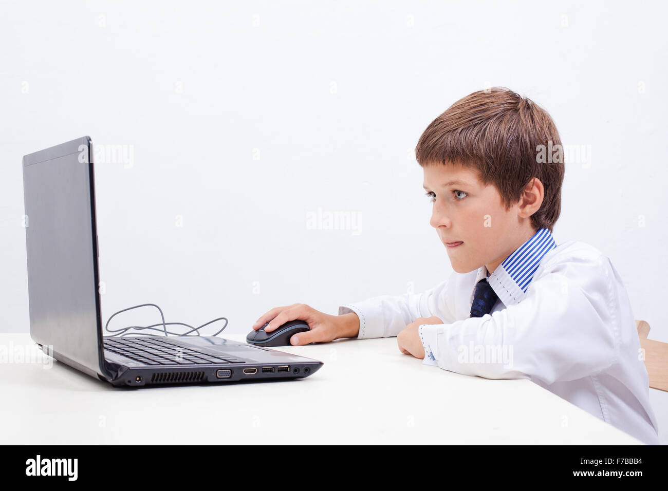 Boy using his laptop computer Stock Photo - Alamy