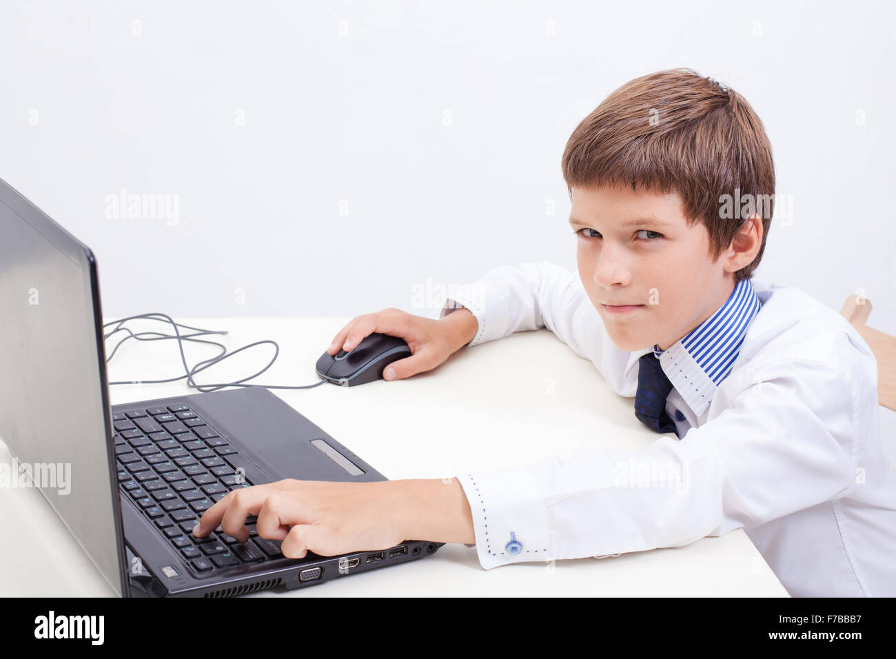 Boy using his laptop computer Stock Photo - Alamy